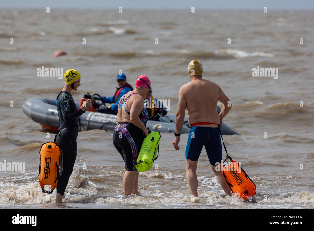 Cold water swimmers thinking about getting into the water Stock Photo ...