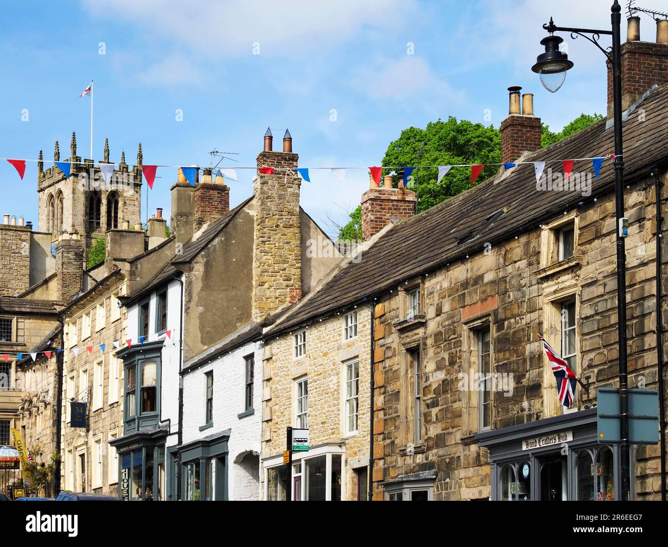 Historic buildings and the tower of St Marys Church along The Bank at ...