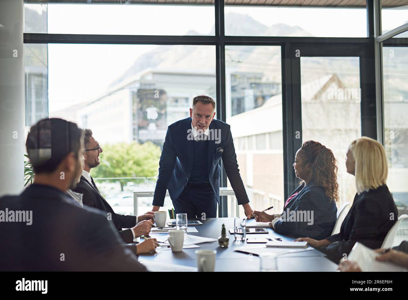 Presentation, man speaker with coworkers and in business meeting in a ...