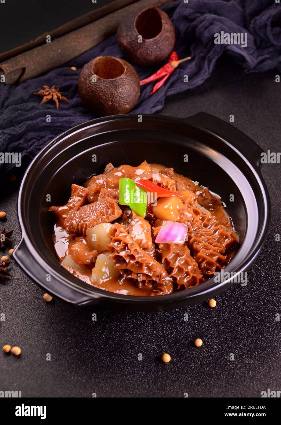 A bowl of traditional Chinese food filled with chunks of meat ...