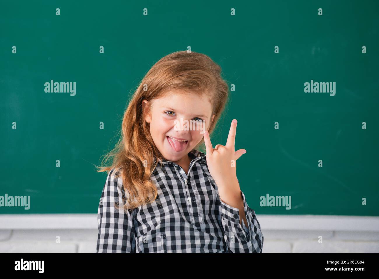 Portrait of funny pupil girl of primary school study. Funny kid girl at ...