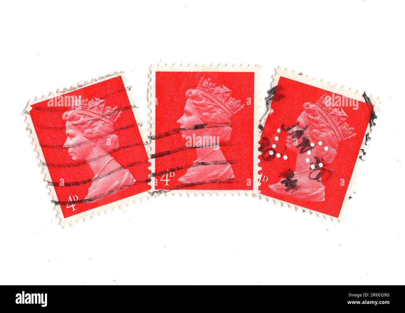 A montage of red 4d vintage postage stamps from the United Kingdom ...