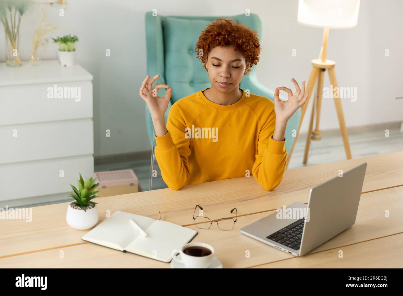 No stress keep calm. Mindful african businesswoman practices breathing ...