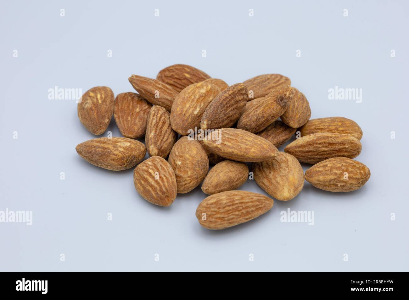 Fresh almonds nut isolated on white background Stock Photo - Alamy