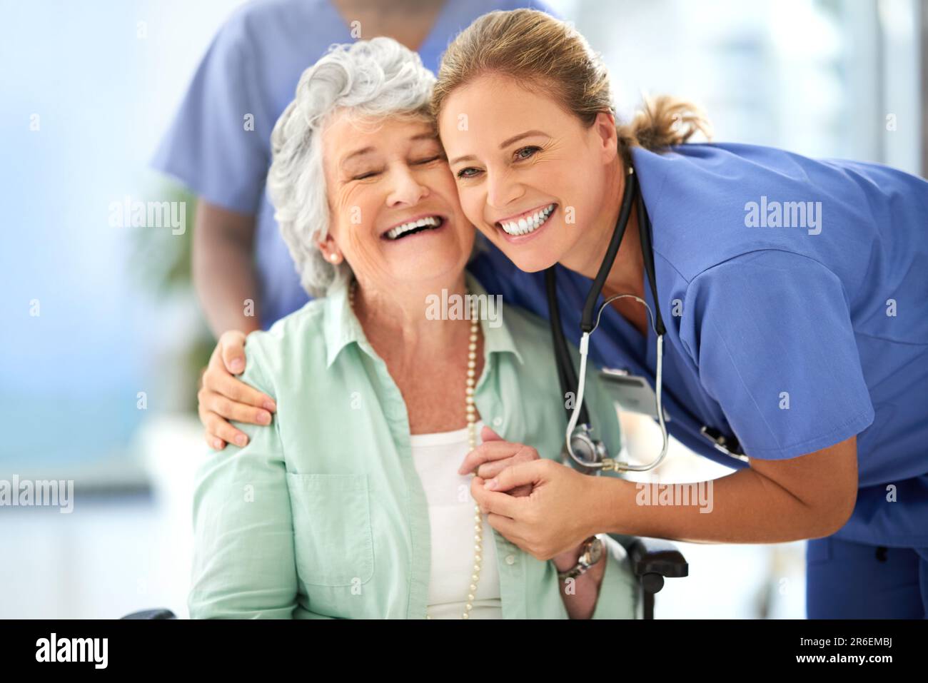 Nurse, senior woman and hug of caregiver and happy smile with support ...