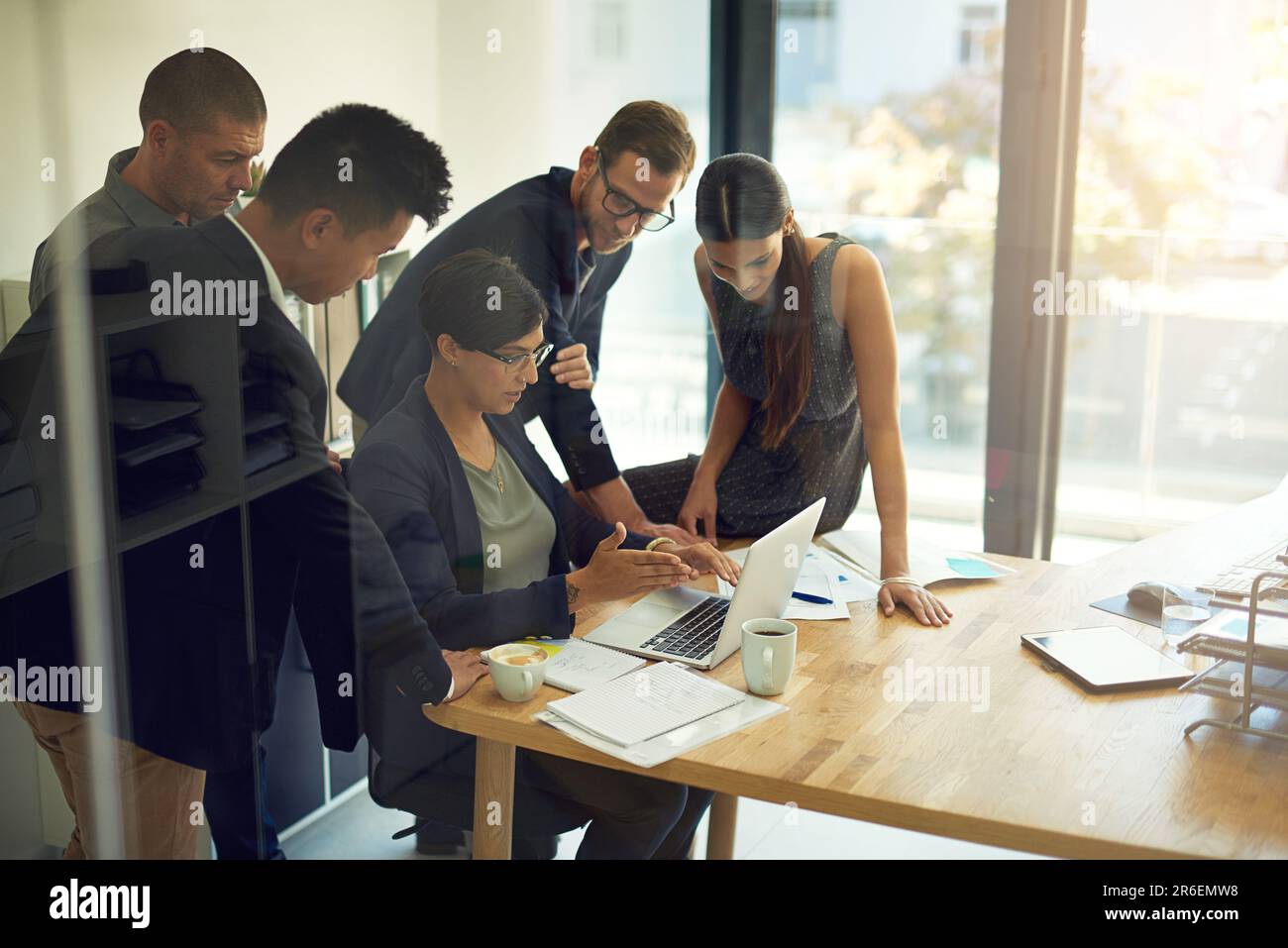 Business meeting, laptop and group of people with website review ...