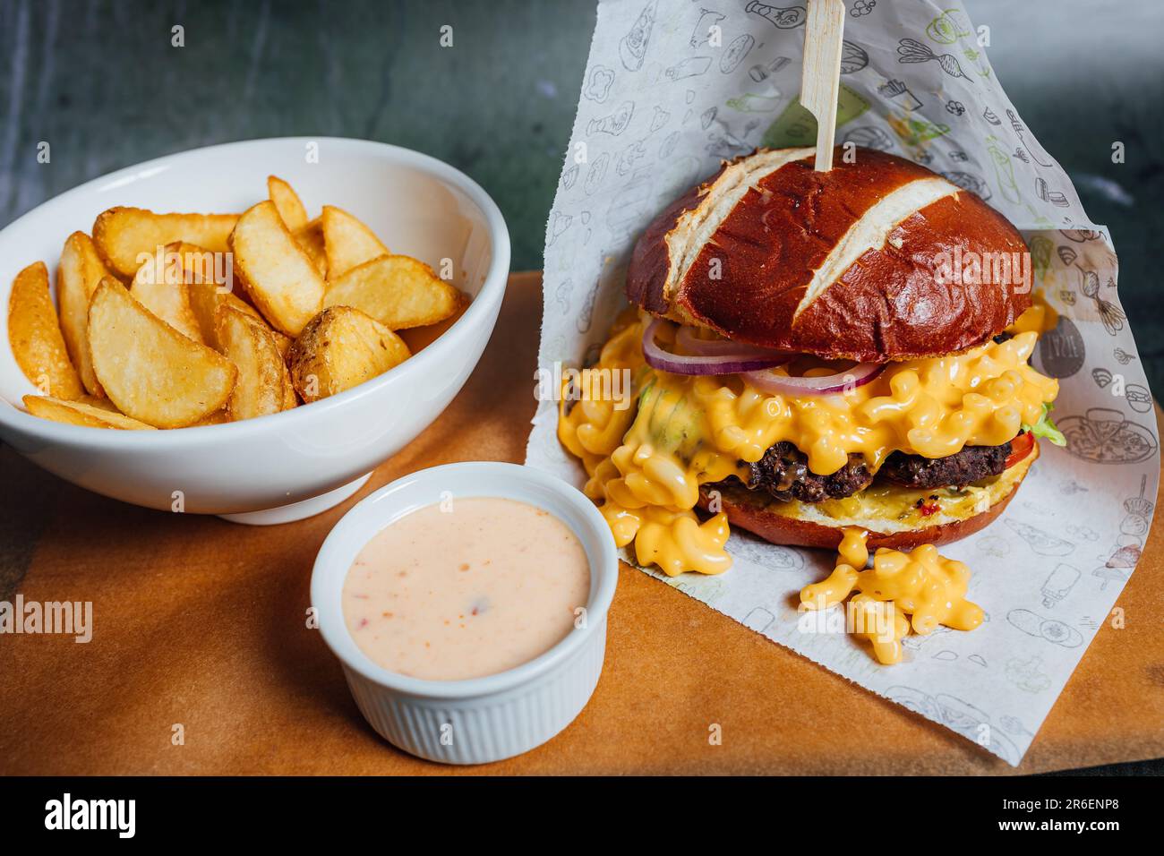 A delicious-looking cheeseburger with fries, lettuce, and tomato ...