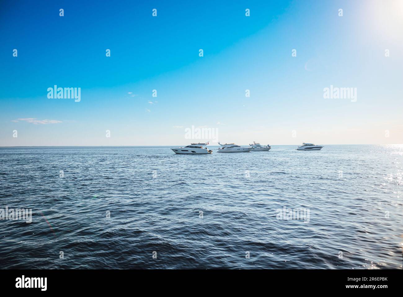 A fleet of ships sailing in the open ocean Stock Photo - Alamy