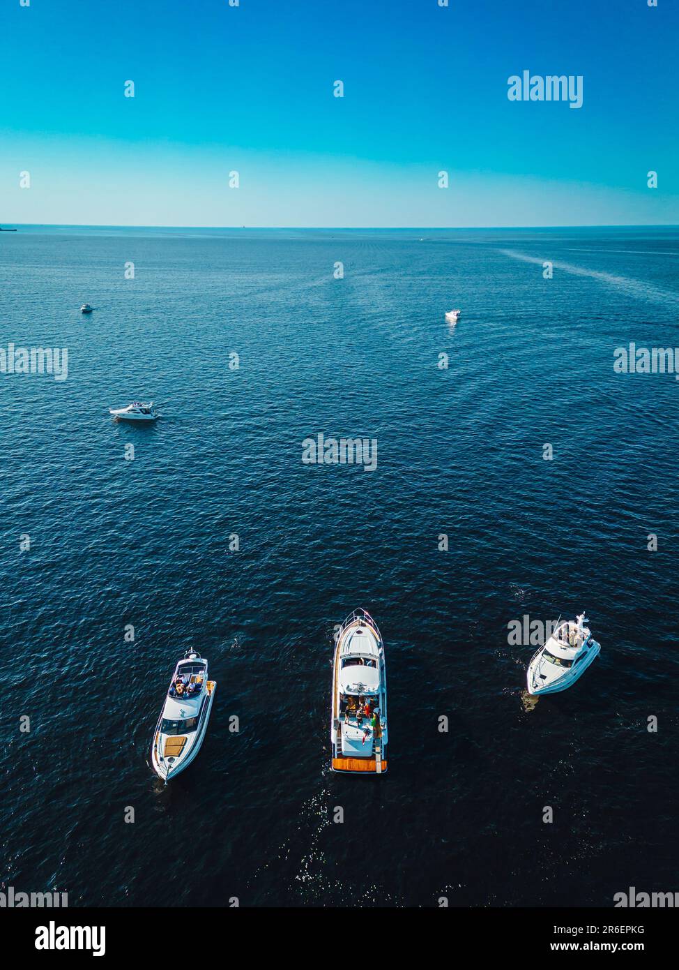 A stunning aerial view of a beachfront, with multiple boats Stock Photo ...