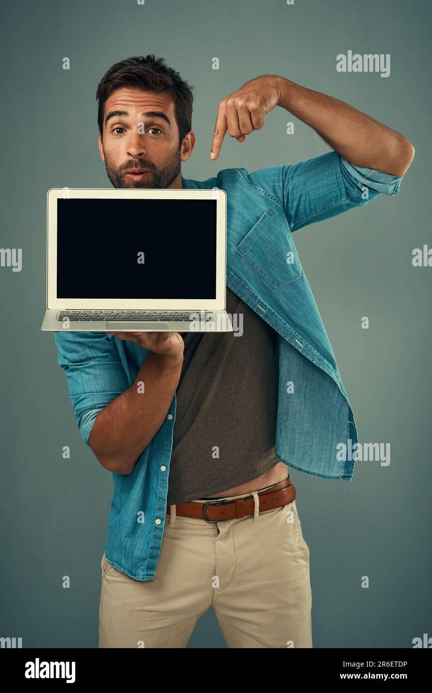 Man, laptop and pointing on mockup screen for advertising or marketing ...