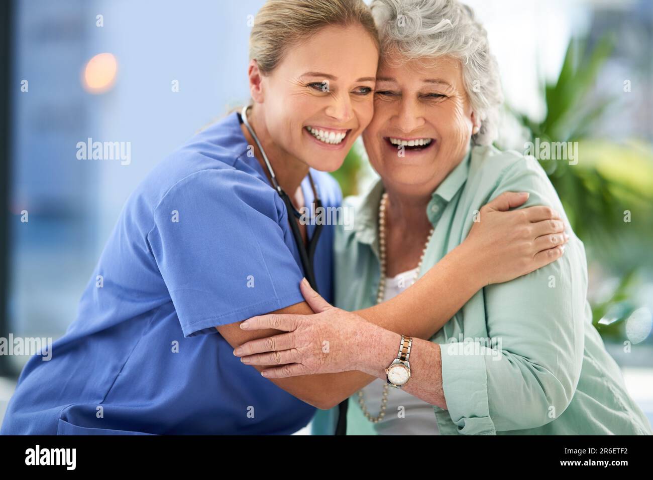 Nurse laugh, senior woman and hug of caregiver and happy smile with ...