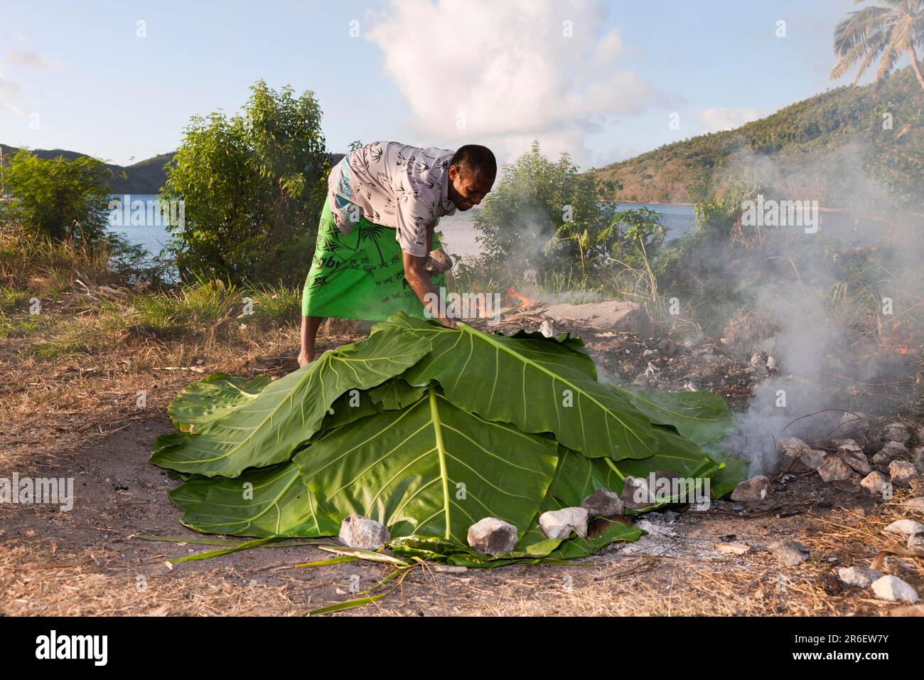 Local cooks with earth oven, Makogai, Lomaviti, Fiji, Fiji Islands ...