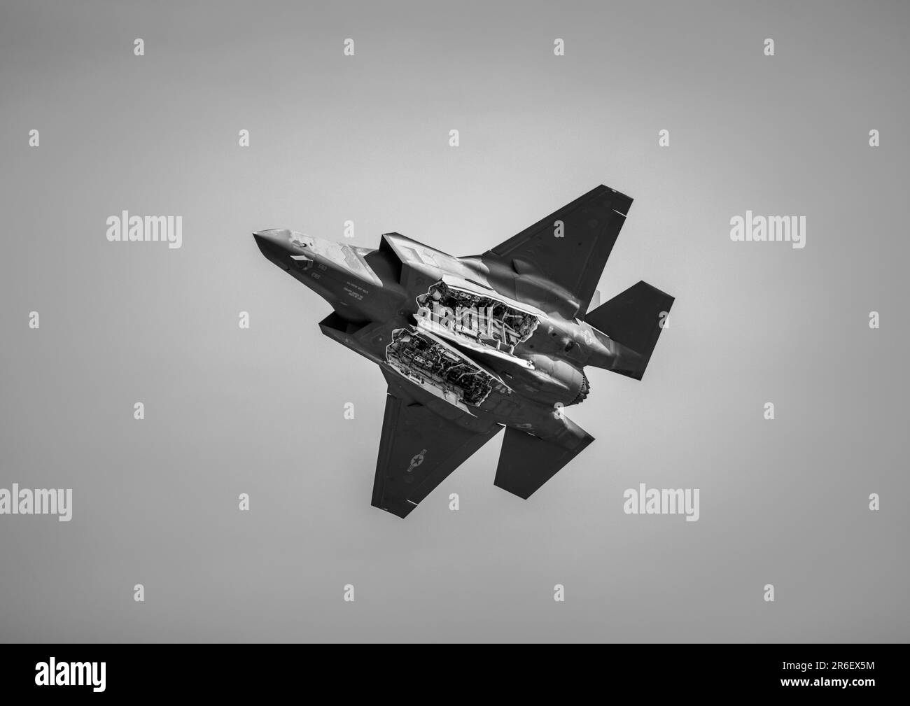 A dramatic black and white of an Air Force F-35 fighter jet soaring ...