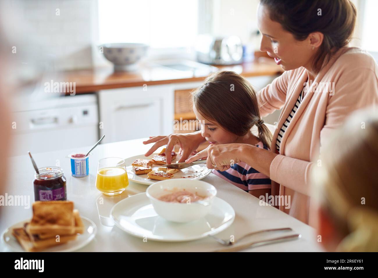Help, love and family with breakfast, smile and bonding with happiness ...