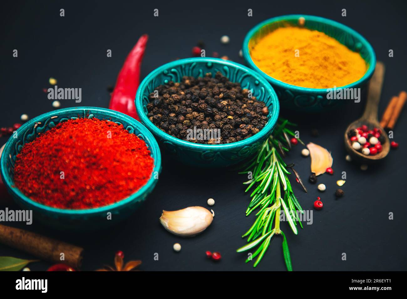 Spices and seasonings for cooking on a dark background. Paprika ...