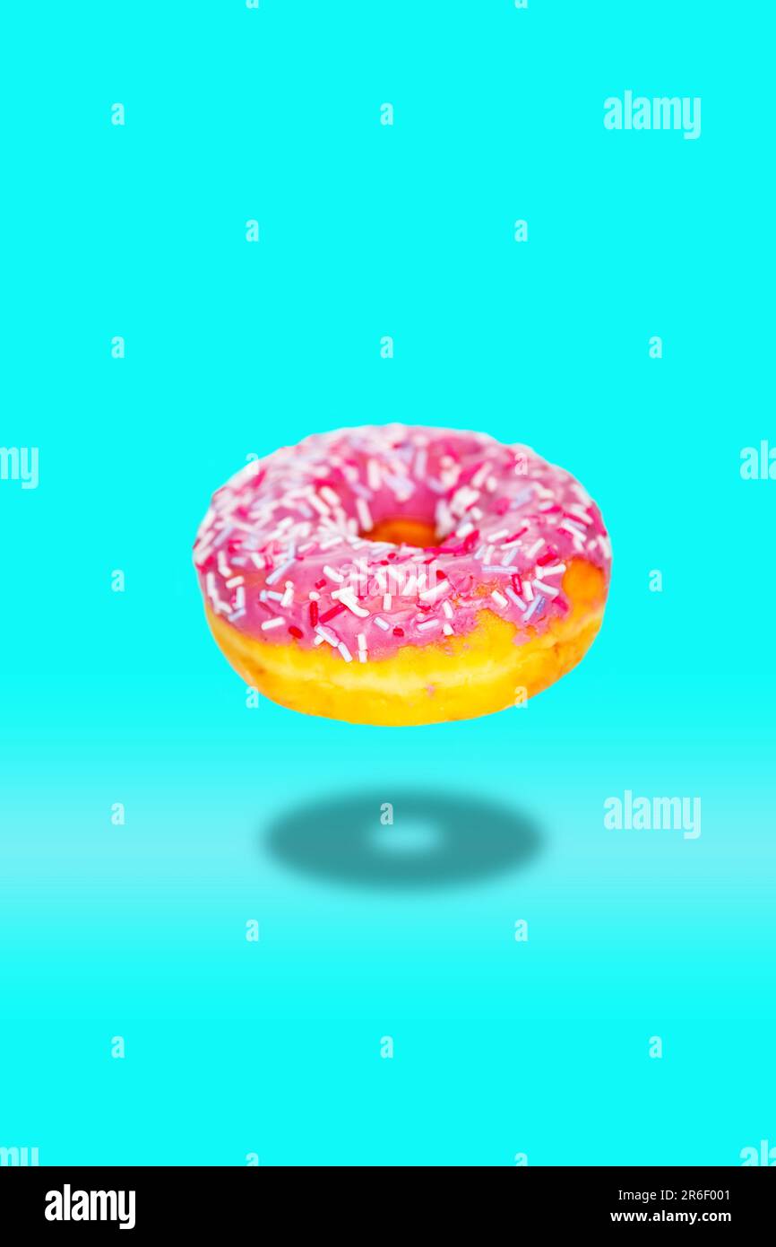 Flying pink donut hi-res stock photography and images - Alamy