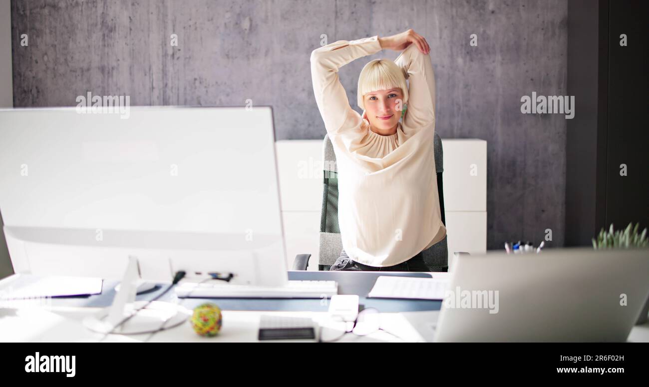 Stretch Exercise Workout At Office Business Desk Stock Photo - Alamy