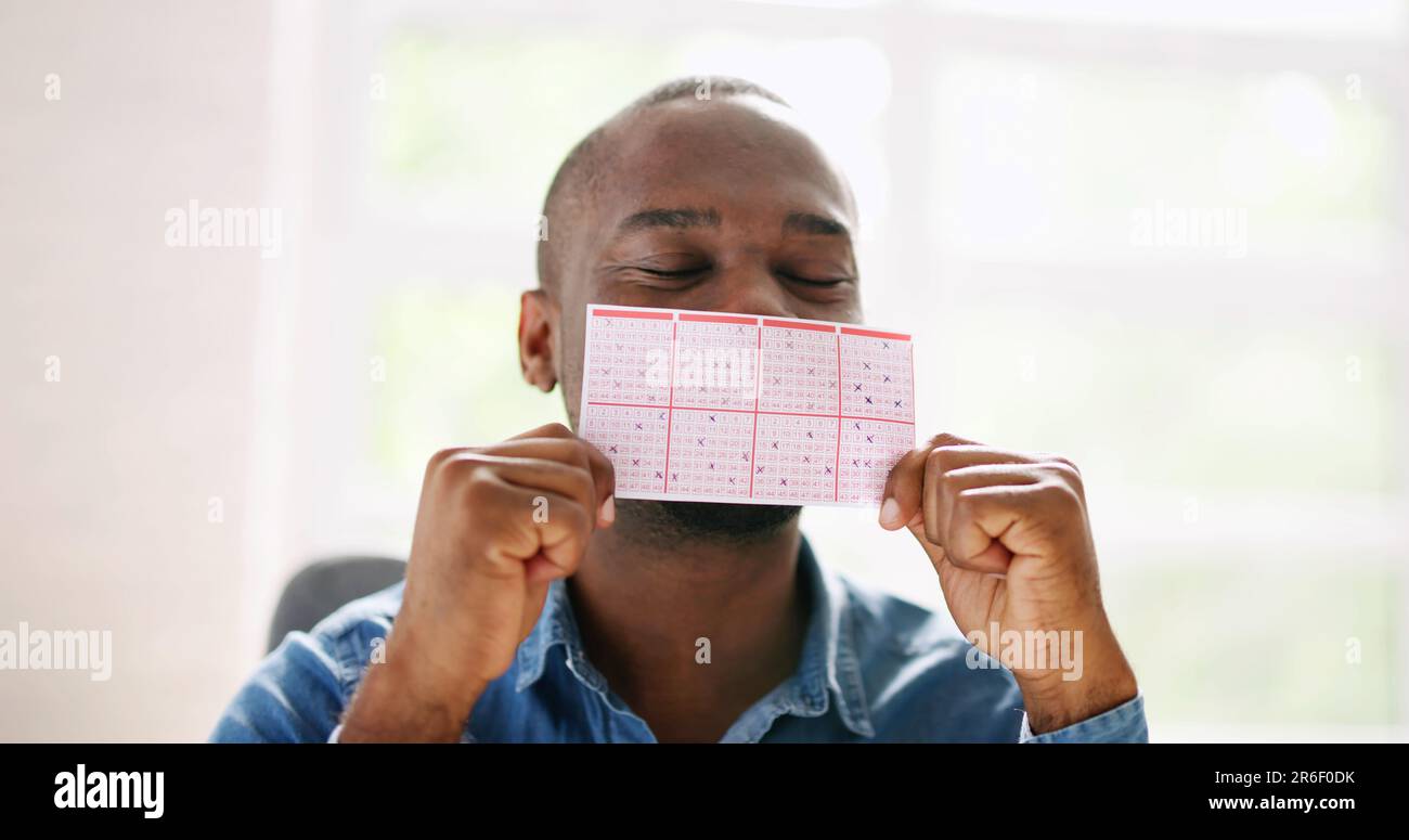 African Man Kissing Gamble Ticket. Lotto Game Card Stock Photo - Alamy