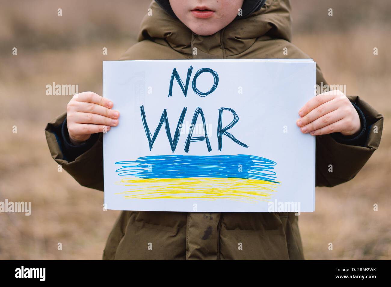 War of Russia against Ukraine. Crying boy asks to stop the war in ...