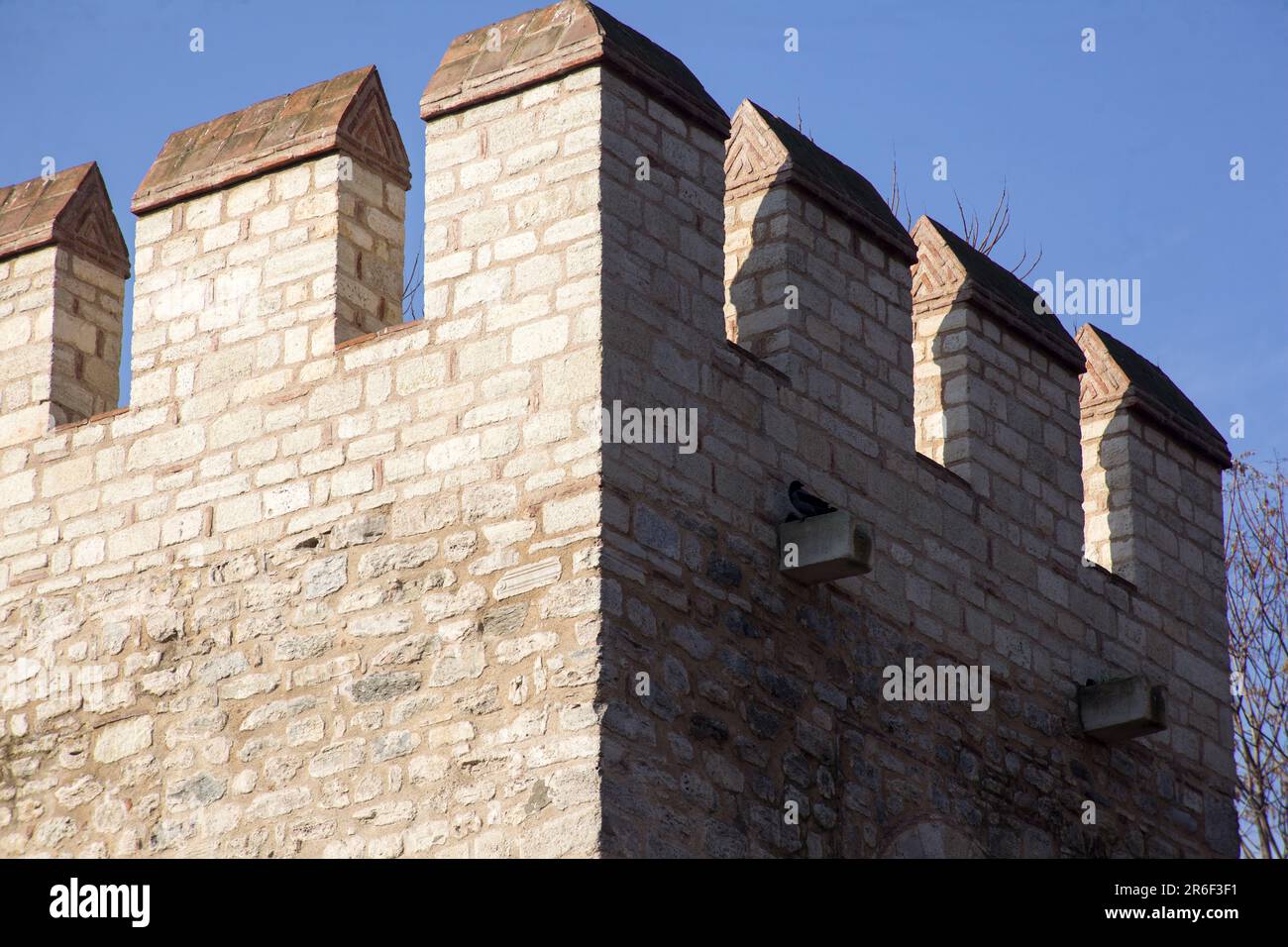 A low angle of a castle turret of brick in sunlight Stock Photo - Alamy