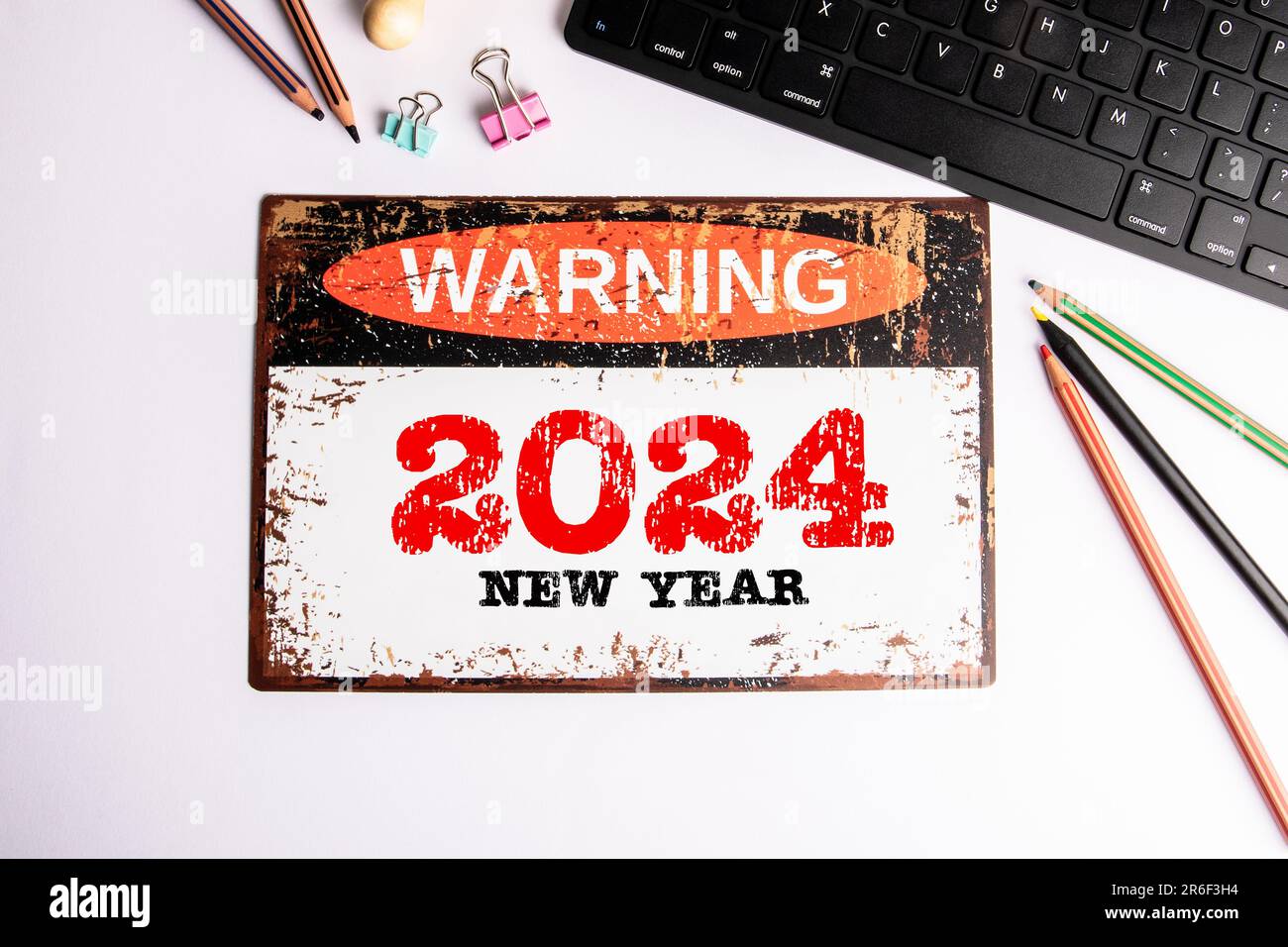 2024 New Year. Warning sign with text on office desk Stock Photo - Alamy
