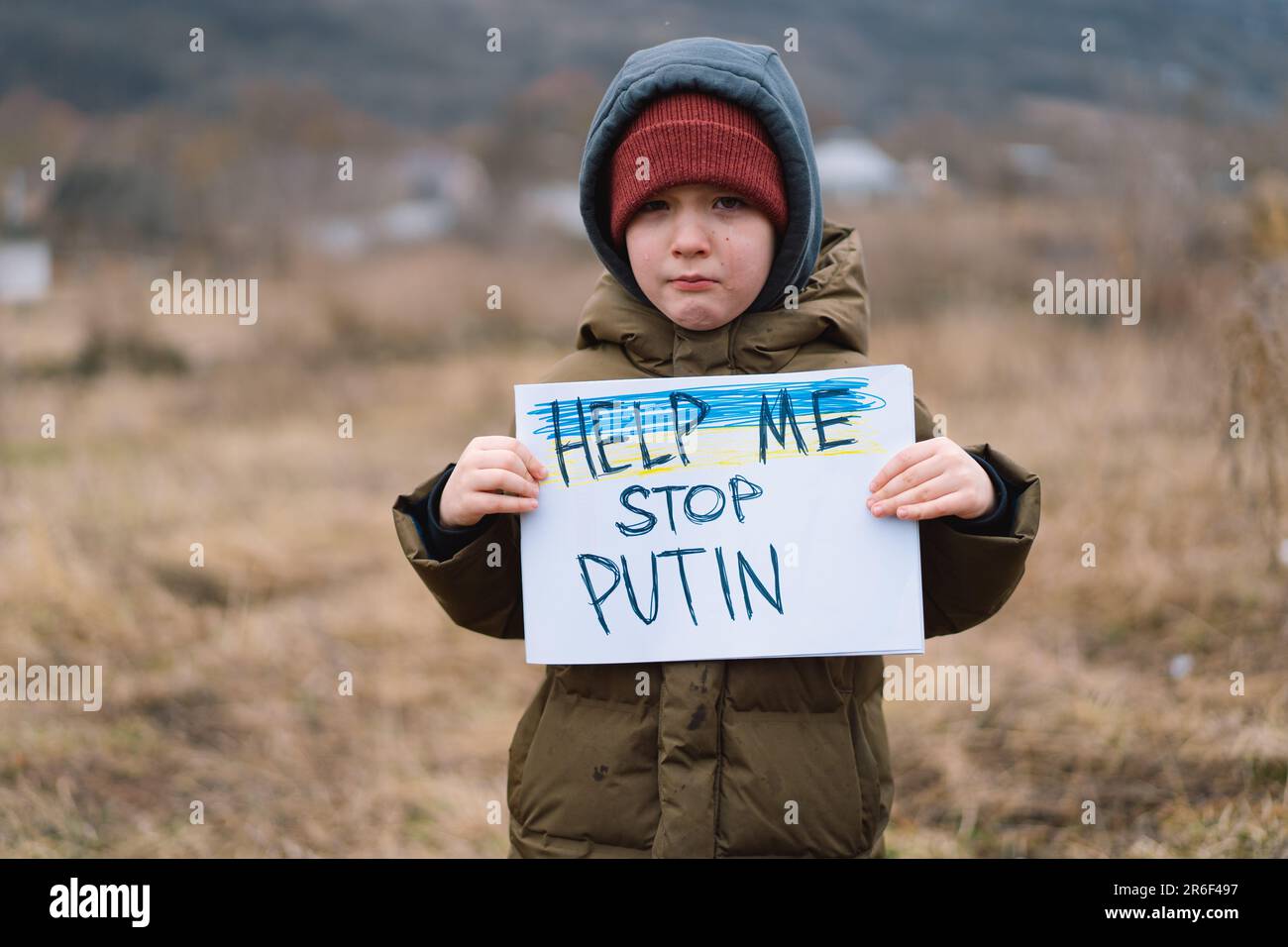 War of Russia against Ukraine. Crying boy asks to stop the war in ...