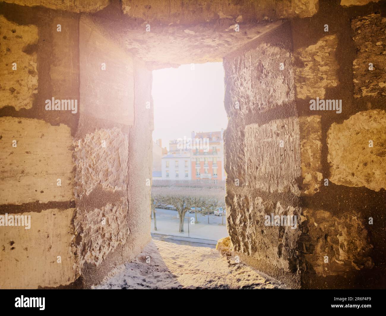 Arrow loop or slit in the wall of Chateau de Vincennes castle Stock ...