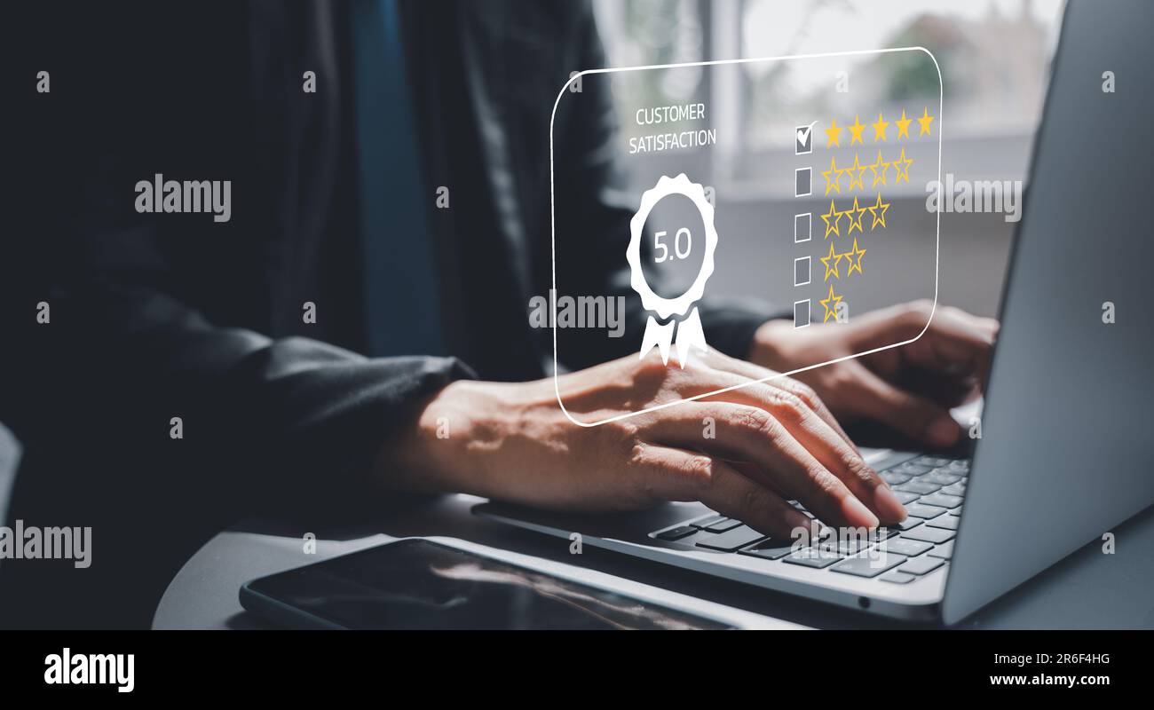 man's hand using a laptop with a 5-star popup for customer service ...