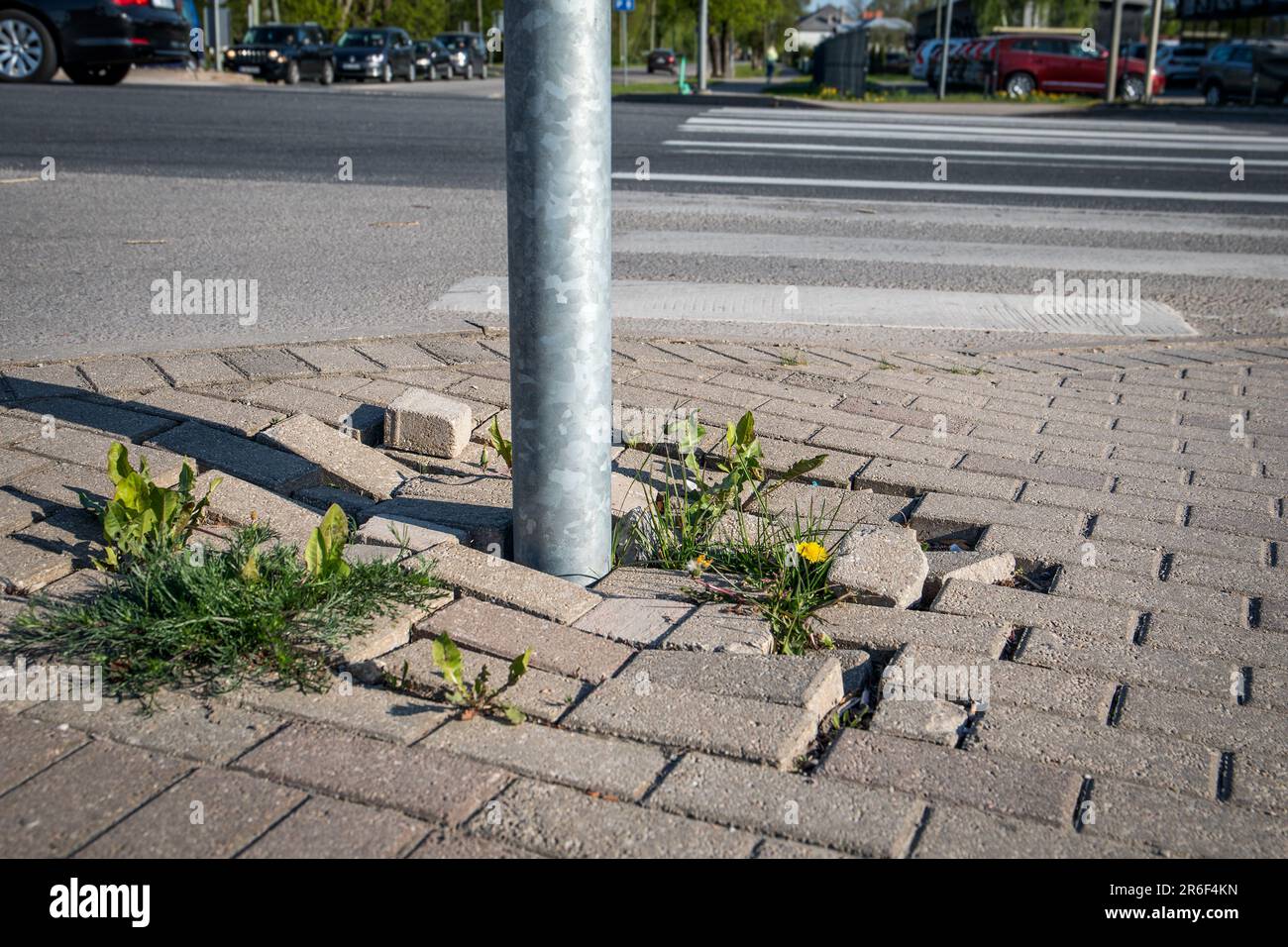 Damaged pavement on the pedestrian sidewalk. Highway and cars Stock ...