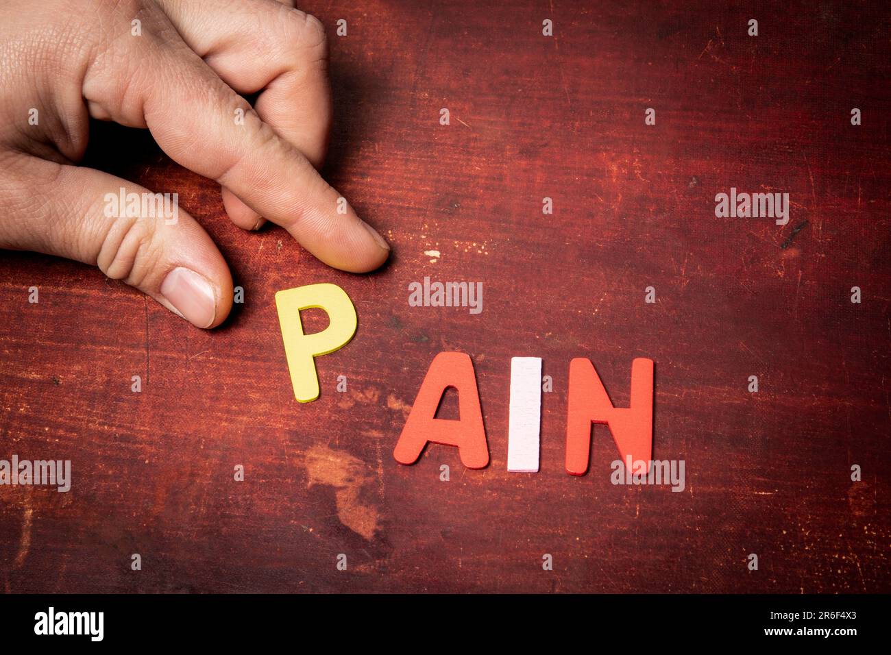 PAIN. Word from colored letters of the alphabet Stock Photo - Alamy