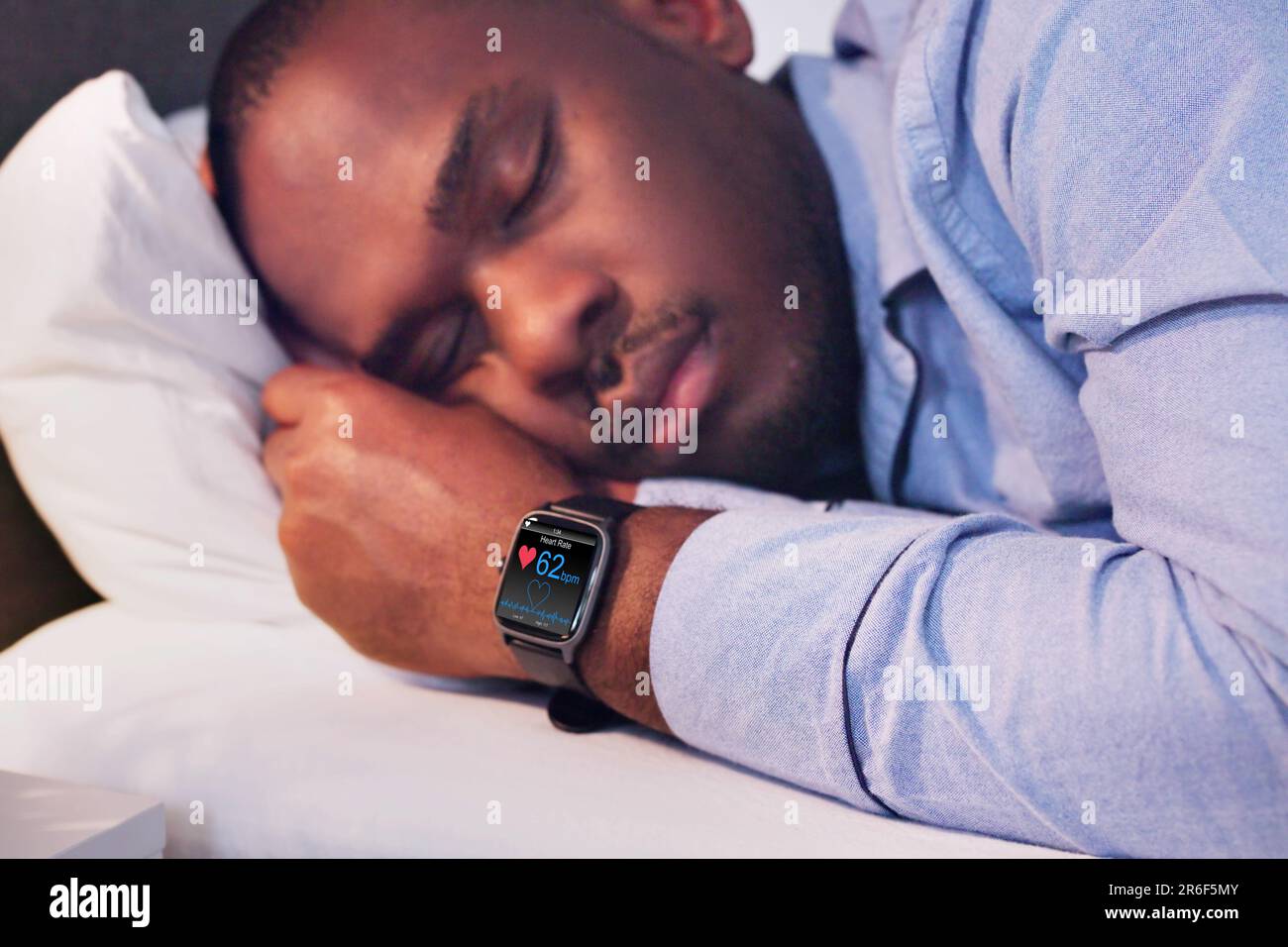 Man Sleeping With Smart Watch In His Hand Showing Heartbeat Rate Stock ...