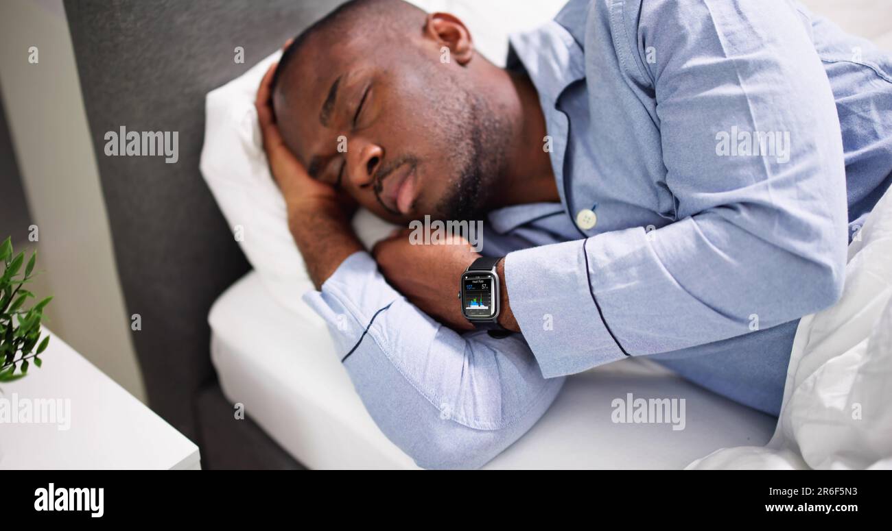 Man Sleeping With Smart Watch In His Hand Showing Heartbeat Rate Stock ...