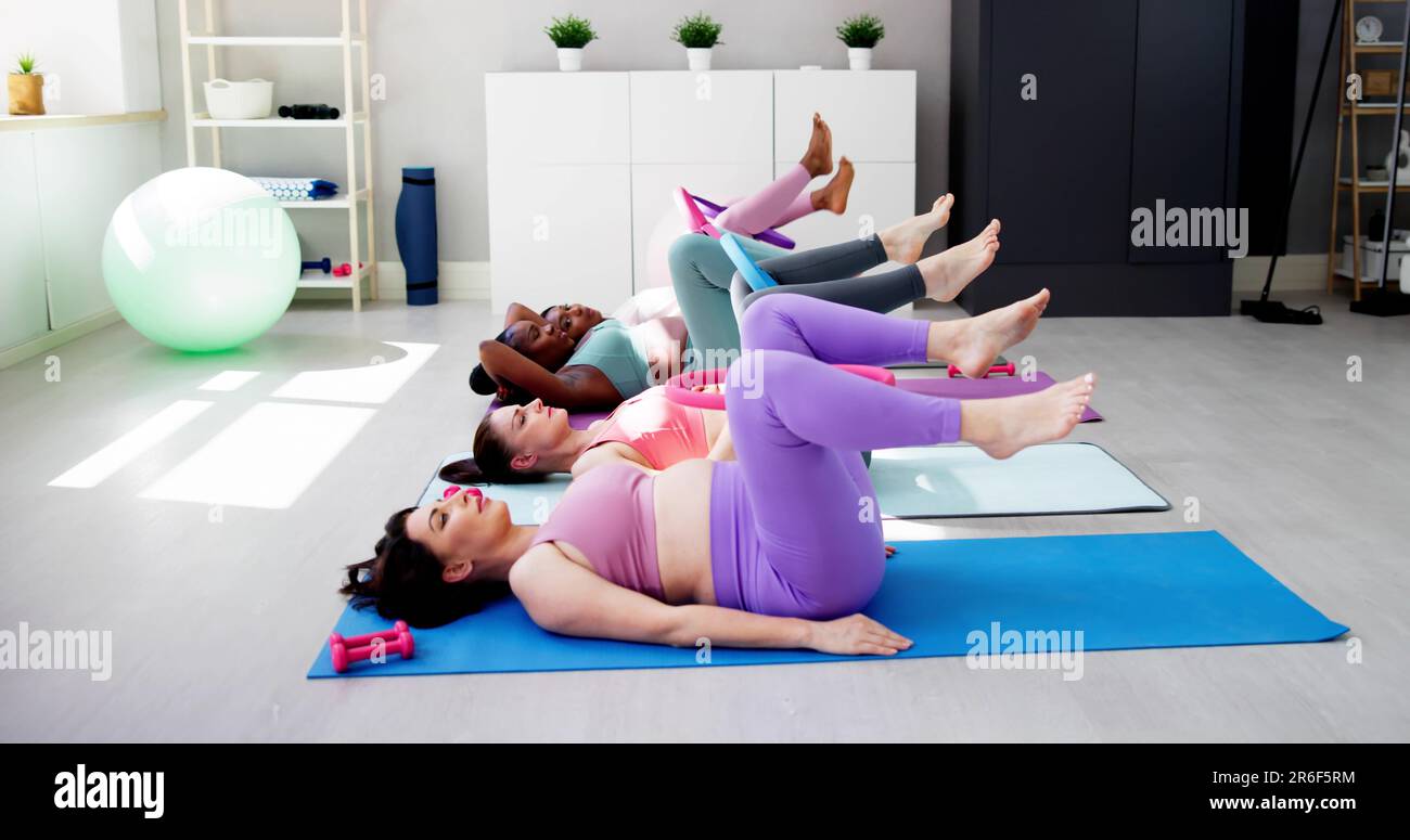 Prenatal Yoga Gym. Pregnant Female Group Fitness Stock Photo - Alamy