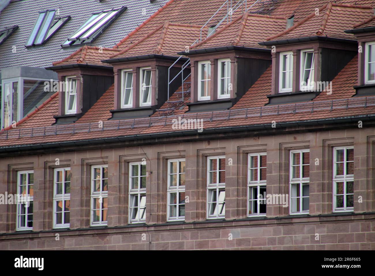 An elderly couple is enjoying an outdoor view while sitting on the ...