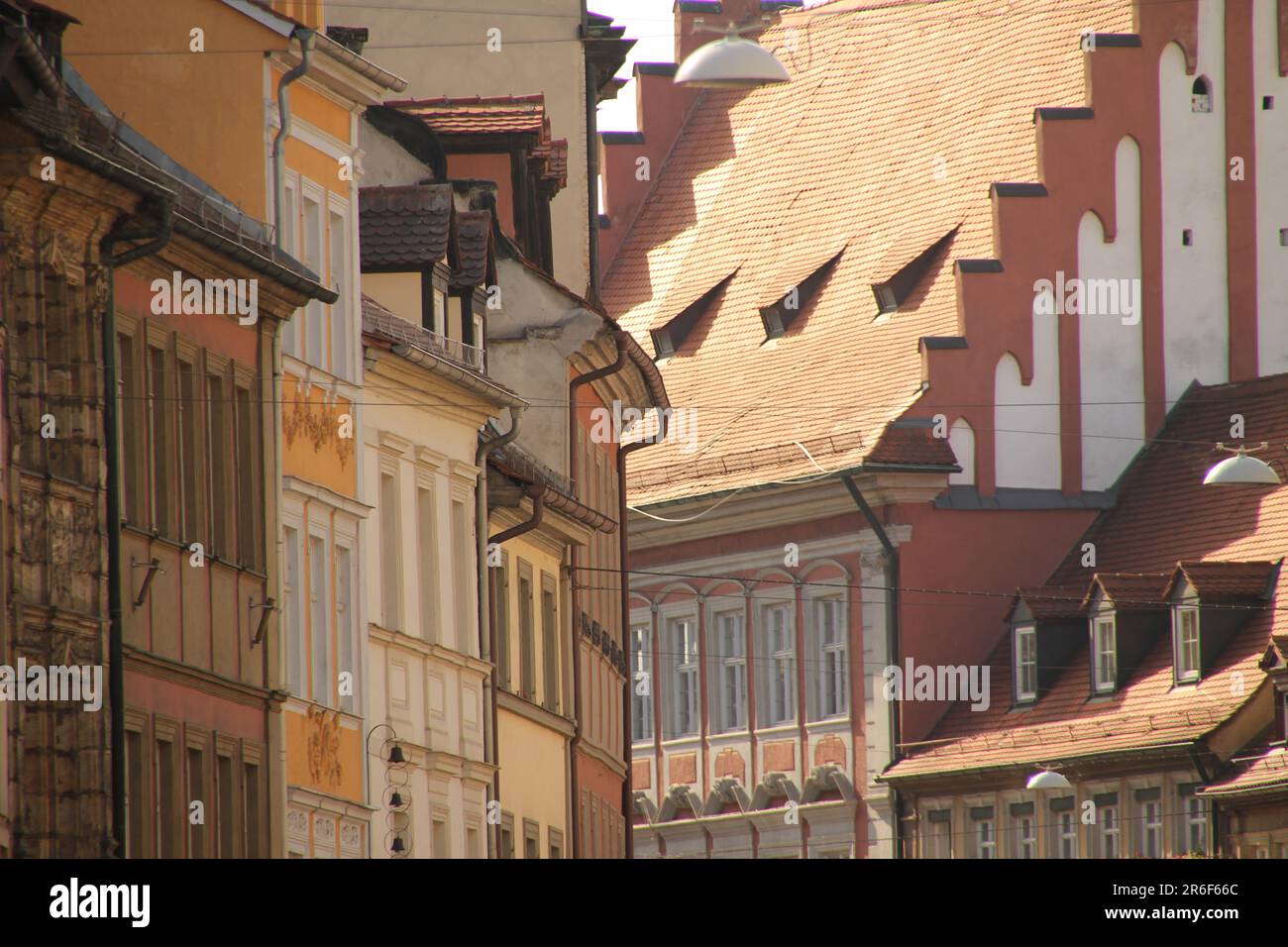 A stunning aerial view of a historic city street below, featuring a ...