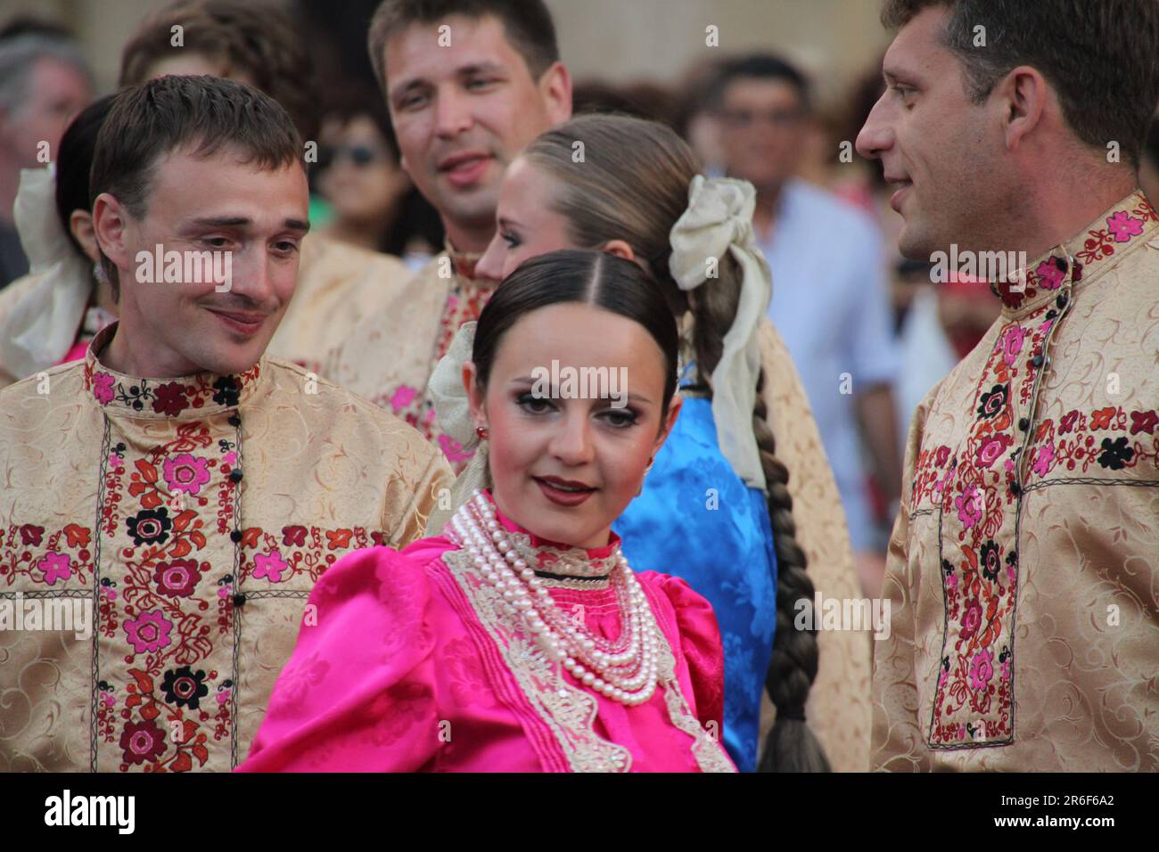 Group of diverse people wearing traditional cultural clothing in an ...