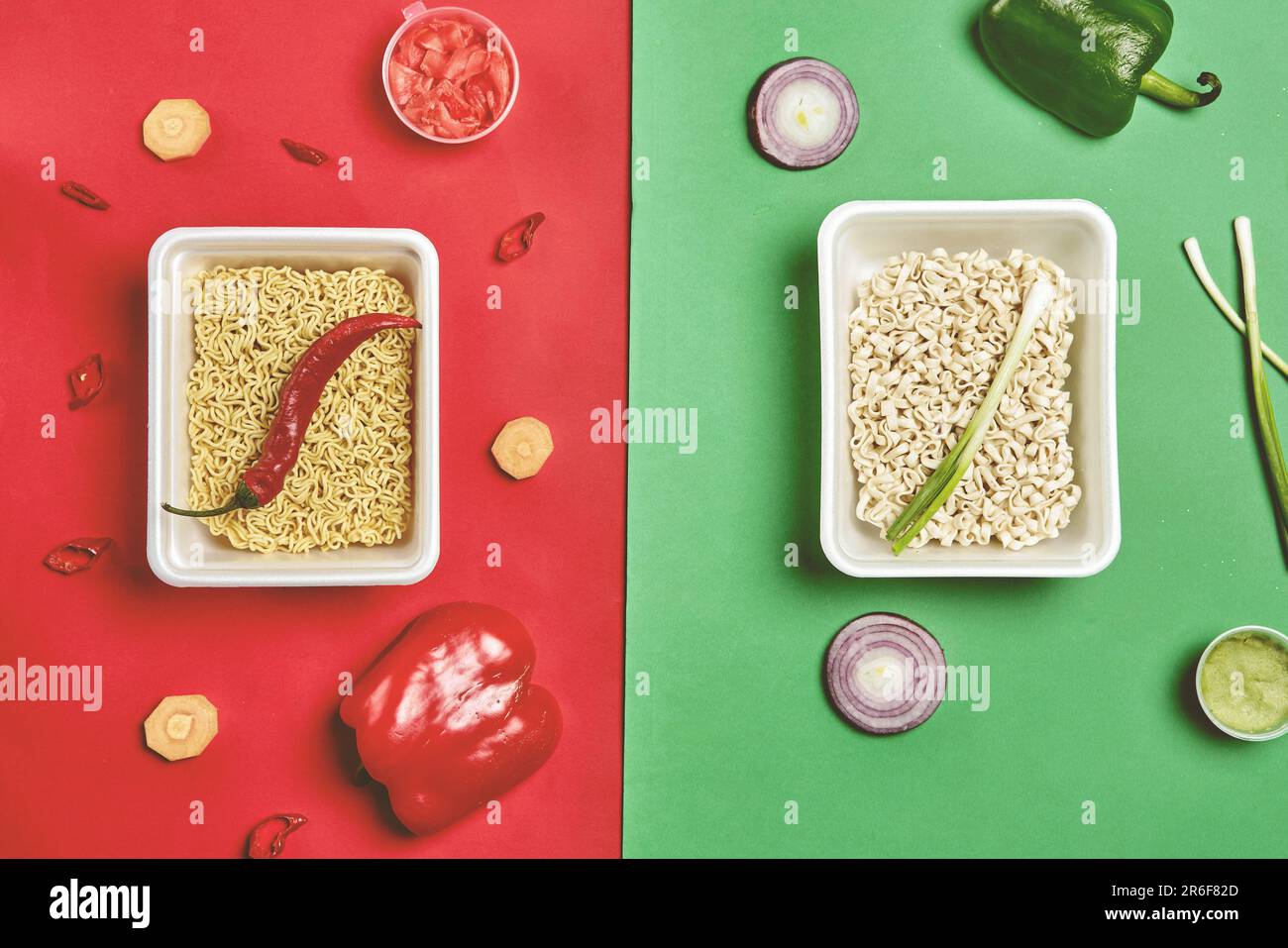 A close-up view of two plates filled with assorted instant noodles ...