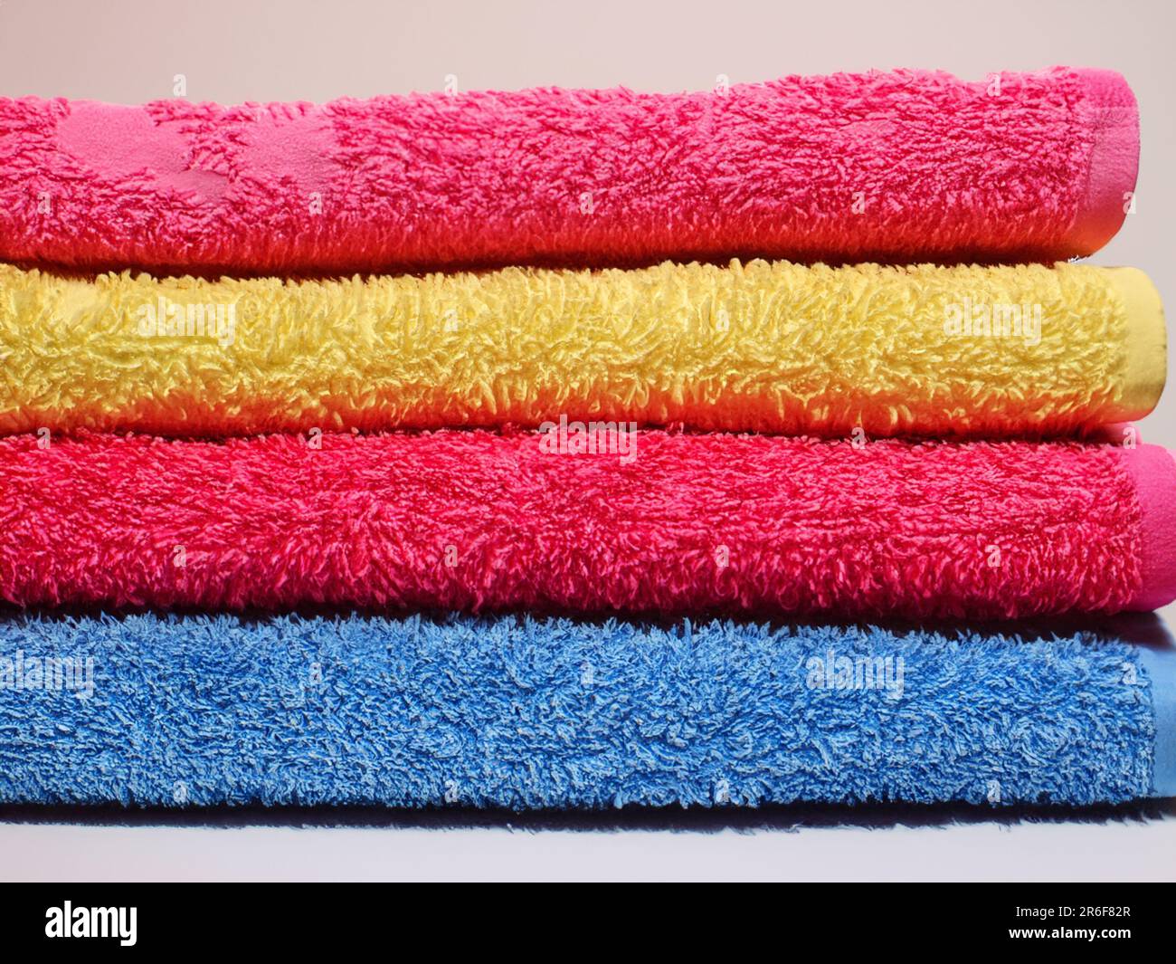 a stack of colorful towels sitting on top of each other Stock Photo - Alamy
