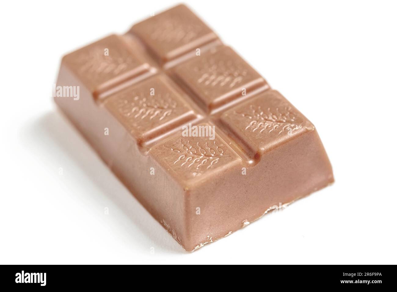 A delicious looking chocolate bar sits on a plain white background ...