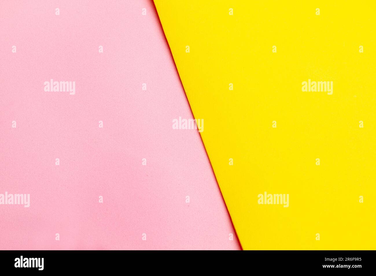 A pink and yellow paper divided background with shadow Stock Photo - Alamy