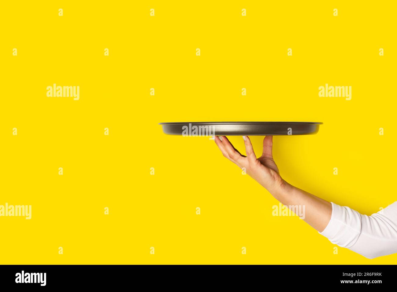 Holding metal tray showing hi-res stock photography and images - Alamy