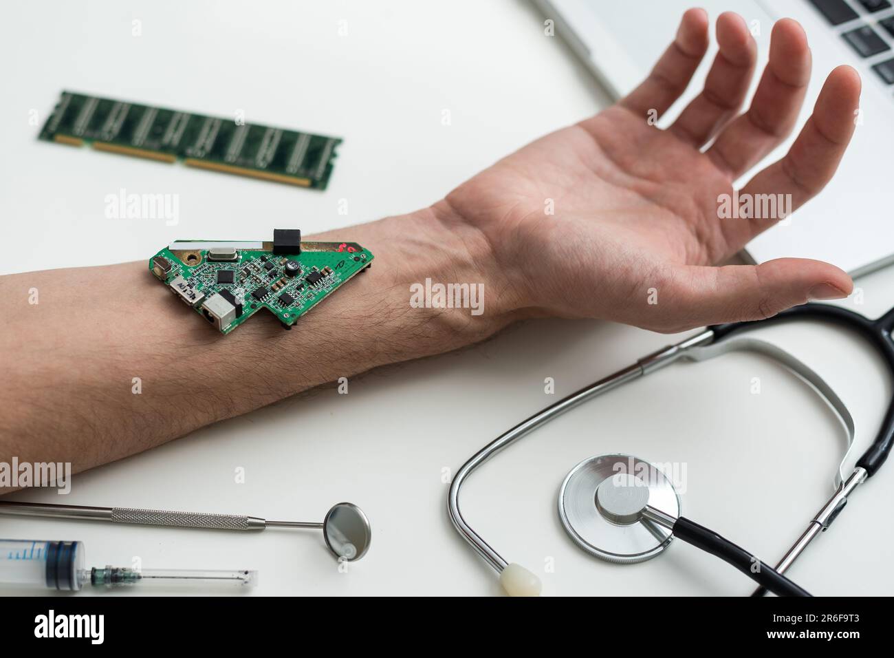 The cosmetic surgeon made a small incision to insert the chip into the ...