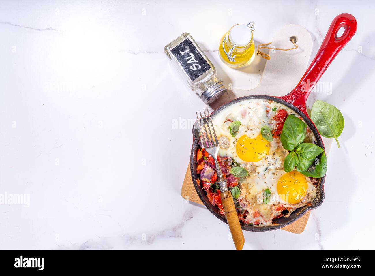 Shakshuka, Fried Eggs with Tomato Sauce and vegetables in Portioned Frying Pan. Tasty Middle ...