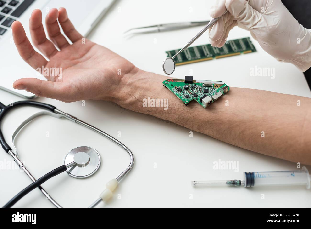 The cosmetic surgeon made a small incision to insert the chip into the ...