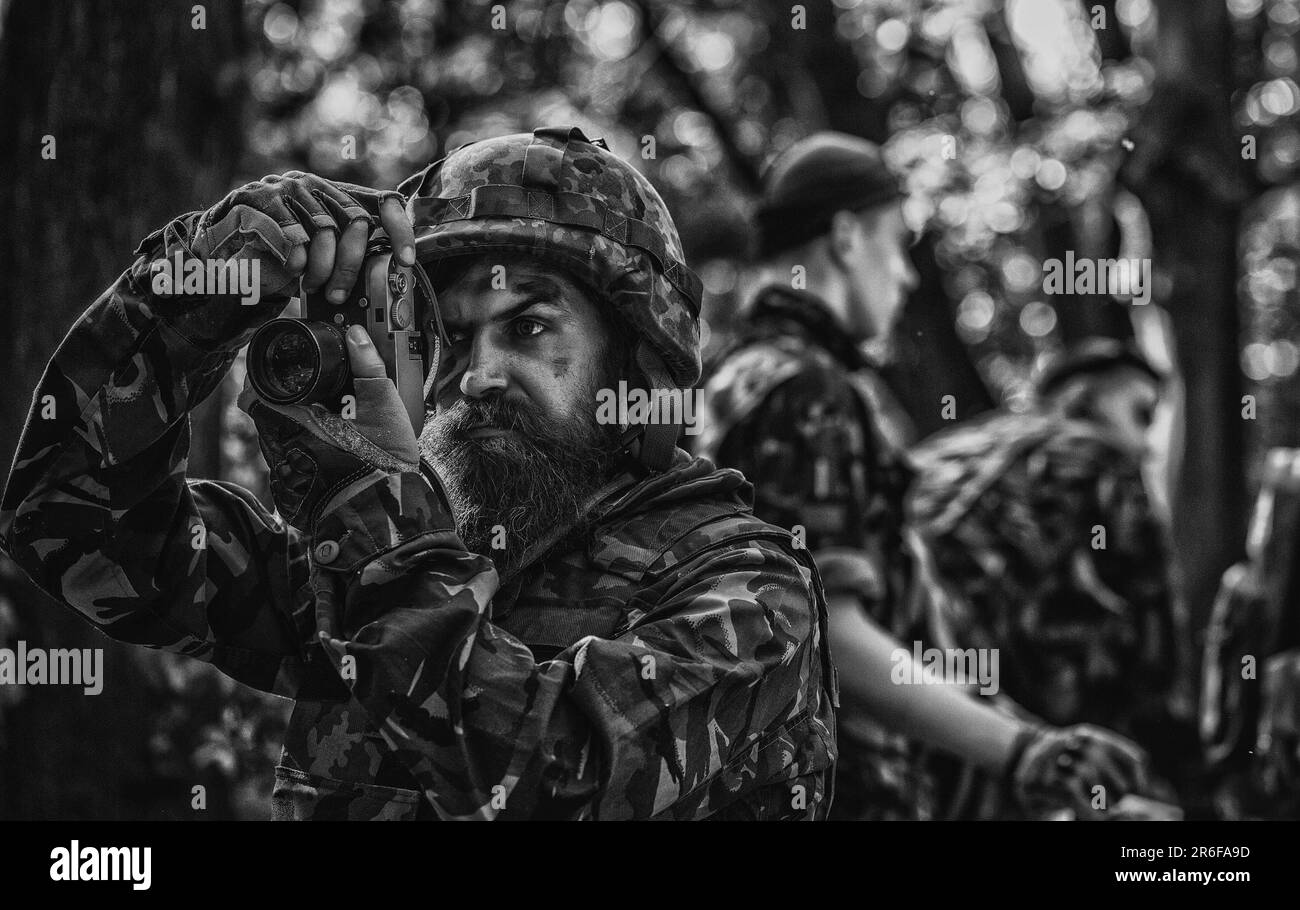 Photojournalist documenting war, military press photographer. Military ...