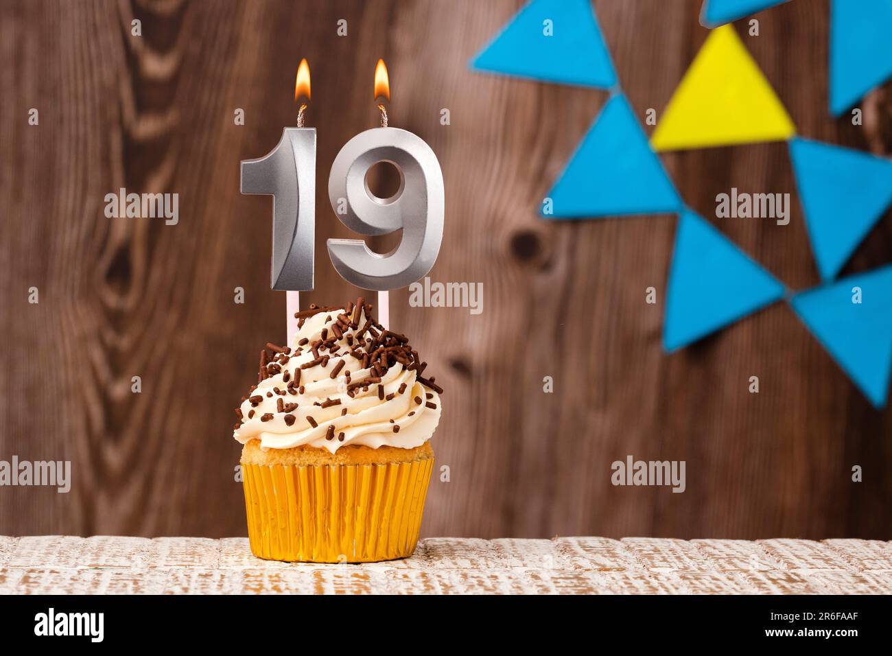 Birthday card with candle number 19 - Wooden background with pennants ...