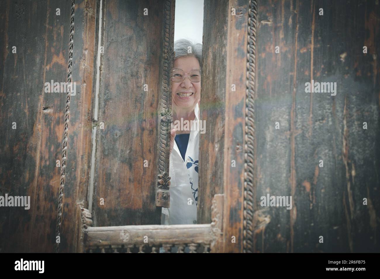 asian old elderly elder senior woman smiling at window Stock Photo - Alamy