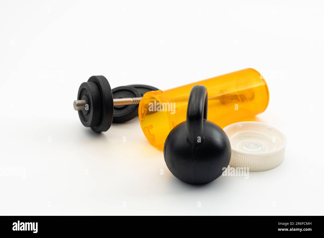 Strength Training Equipment and Prescription Pill Bottle Concept for ...