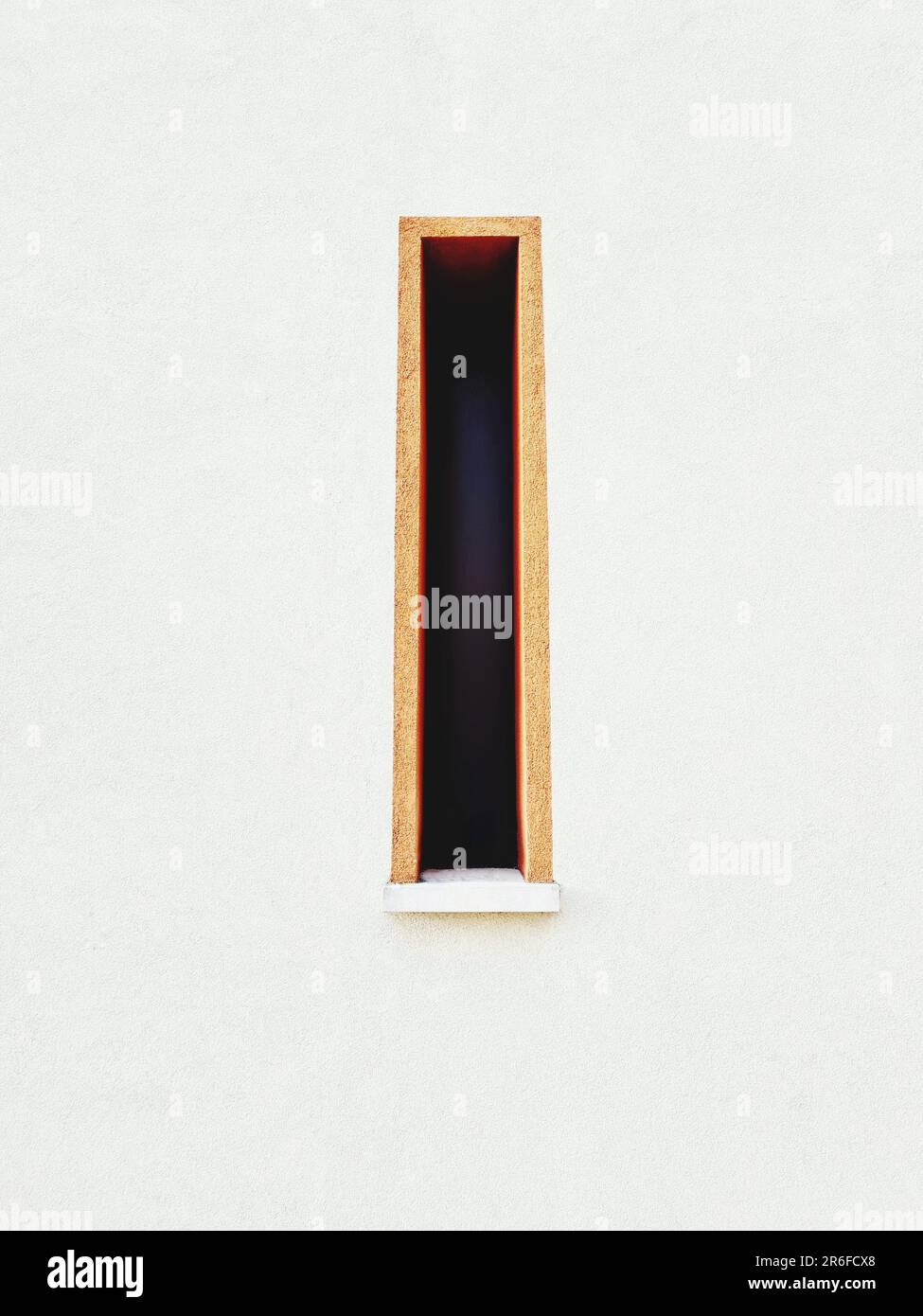 A rustic brick wall with a rectangular tall narrow window Stock Photo ...