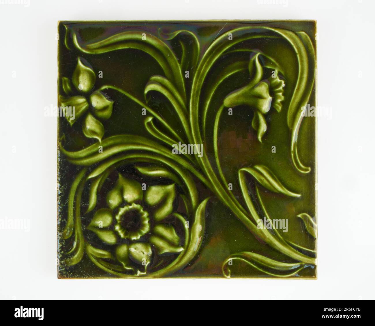 Antique 1900s Art Nouveau Richards green daffodil pottery tile Stock ...